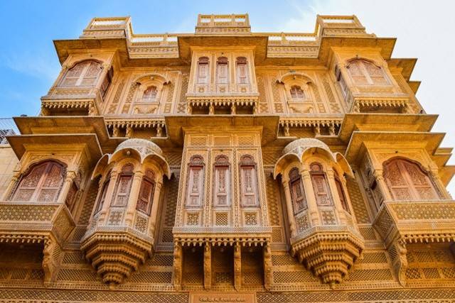 Ornate sandstone facade of a traditional Indian haveli with intricate ...